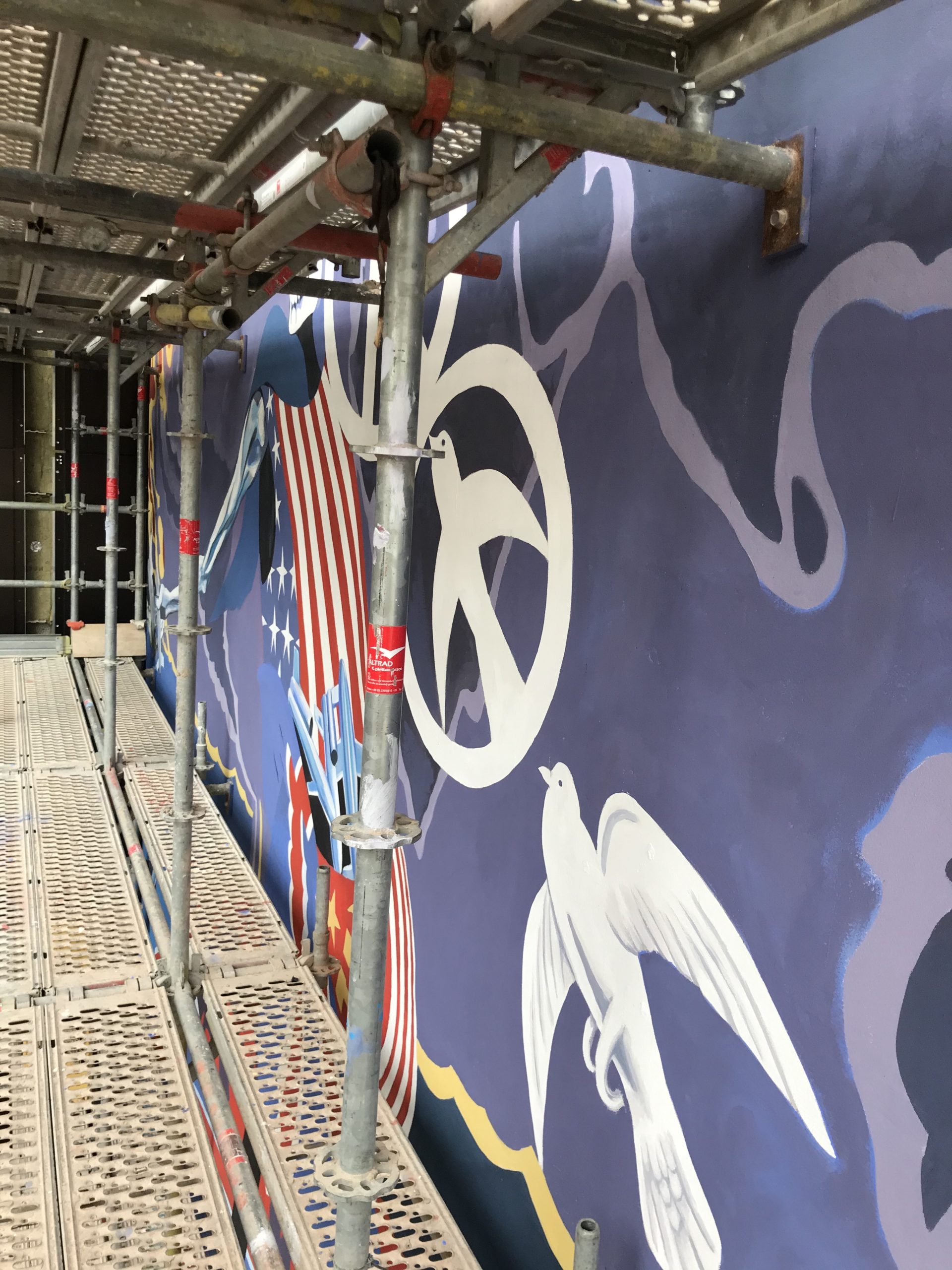 Iconic Brixton peace mural restored to former glory