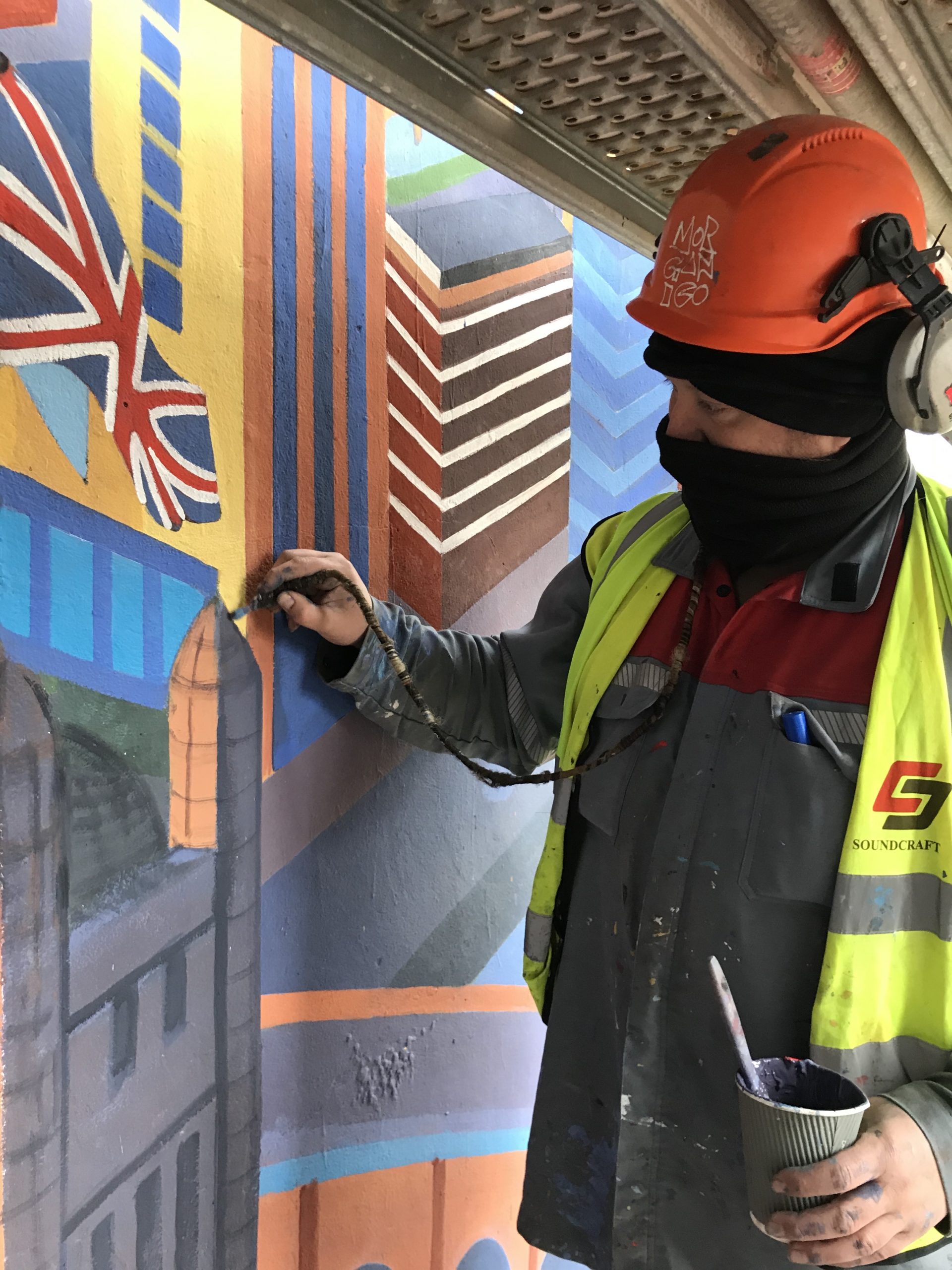 Iconic Brixton peace mural restored to former glory